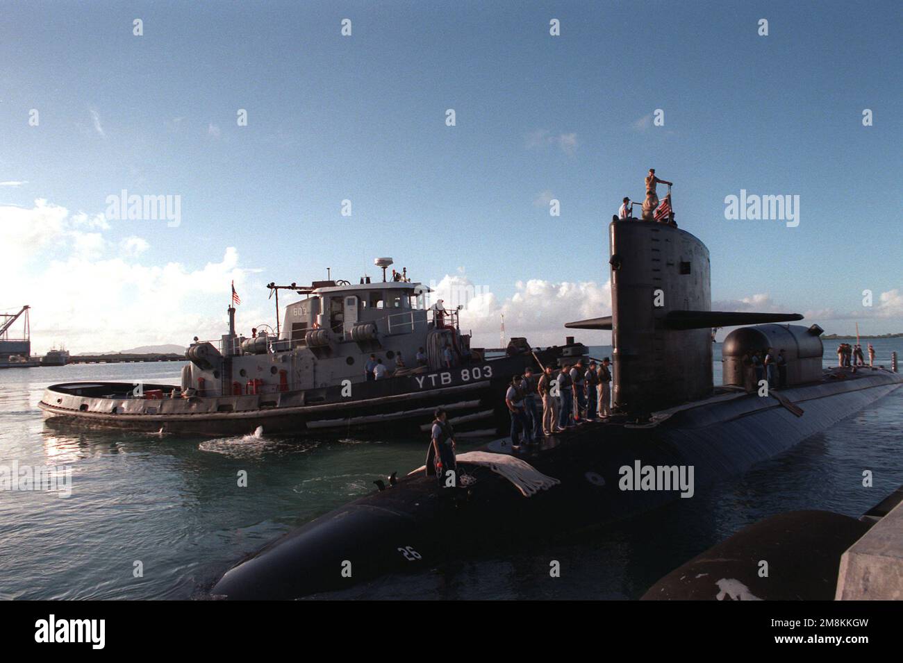The yard tugboat Nanticoke (YTB-803) assist the nuclear-powered attack ...