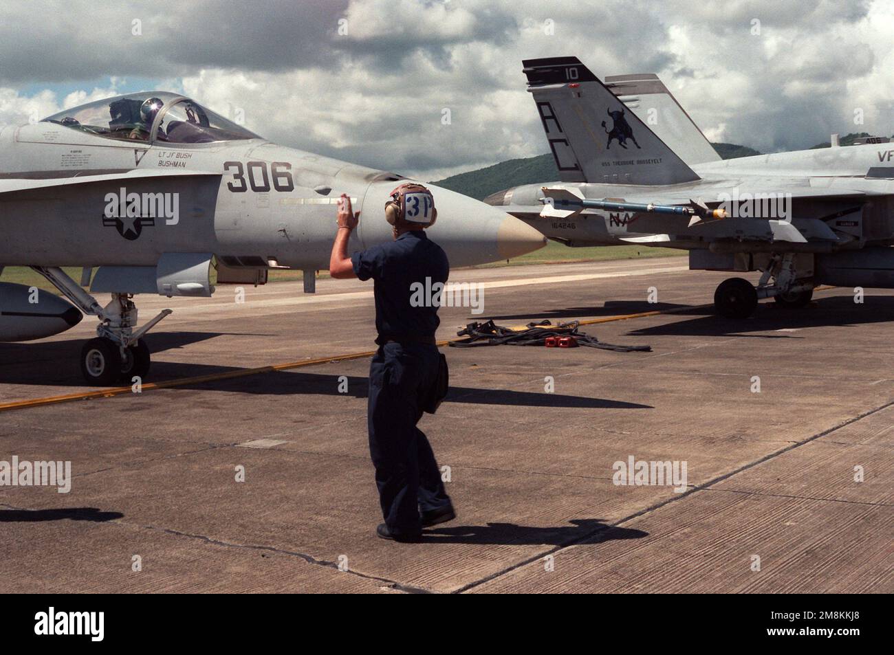 Aviation Structural Mechanic AIRMAN (AMSAN) Roger Murrillo directs ...