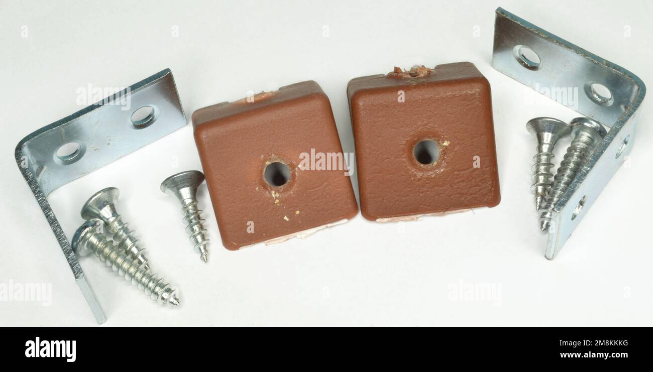 Set made of metal and plastic furniture fittings with fitting screws ...