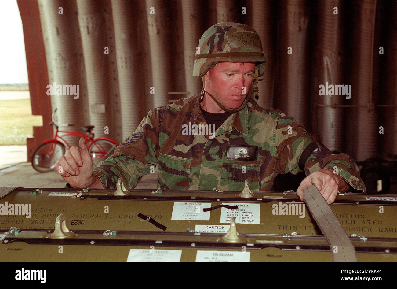 STAFF SGT. Daniel Hutson of the 80th Fighter Squadron inspects a CBU-87 ...