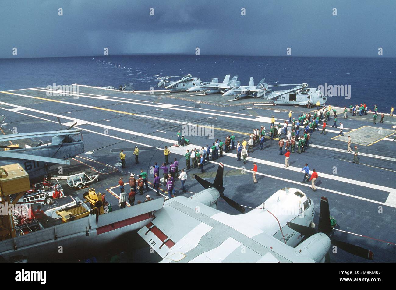 Flight deck crewmen of the aircraft carrier USS JOHN F. KENNEDY (CV-67 ...