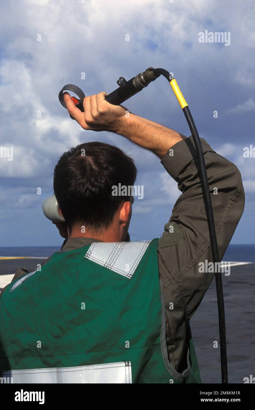 A landing signal officer (LSO) on board the aircraft carrier USS JOHN F ...