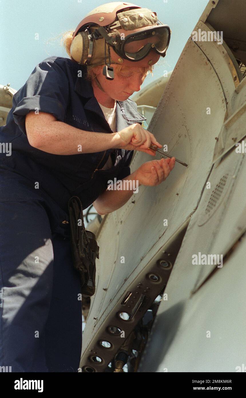 An unidentified female Naval Reservist is completing preventive ...