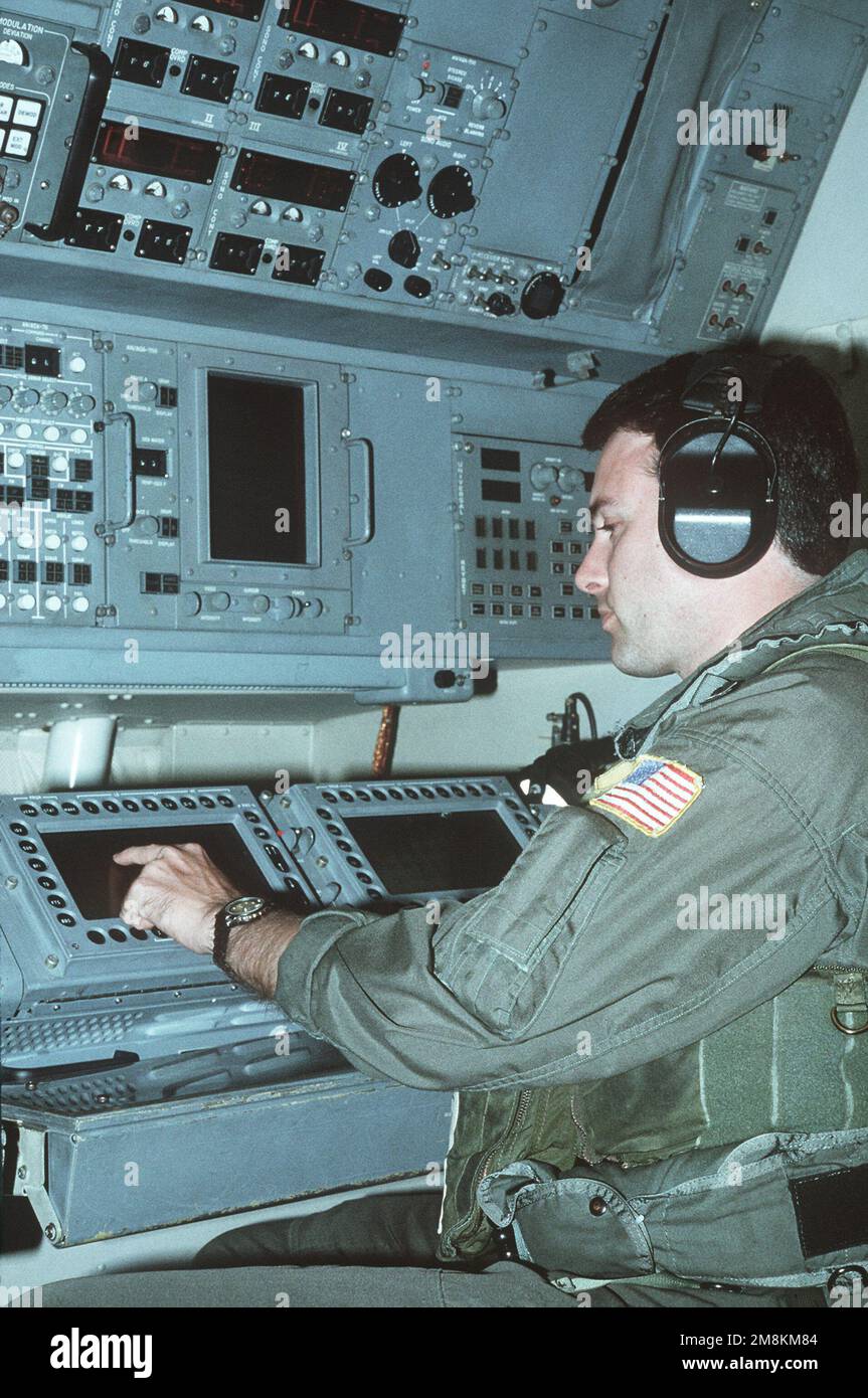 An air crewman on board a P-3C Orion aircraft of Patrol Squadron 68 (VP ...