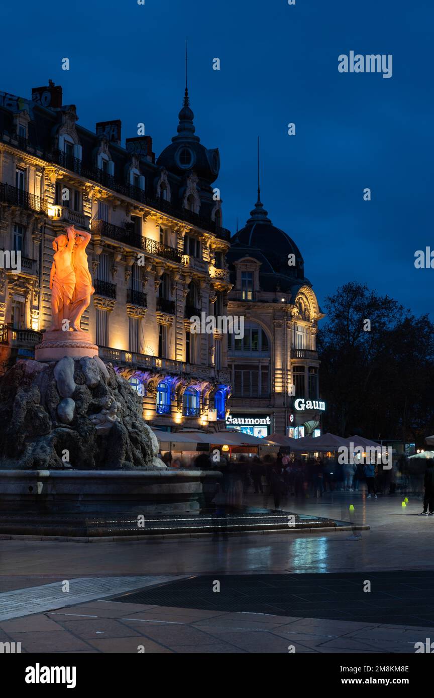 Montpellier, Occitanie, France, 12 28 2022 - People around the statue ...