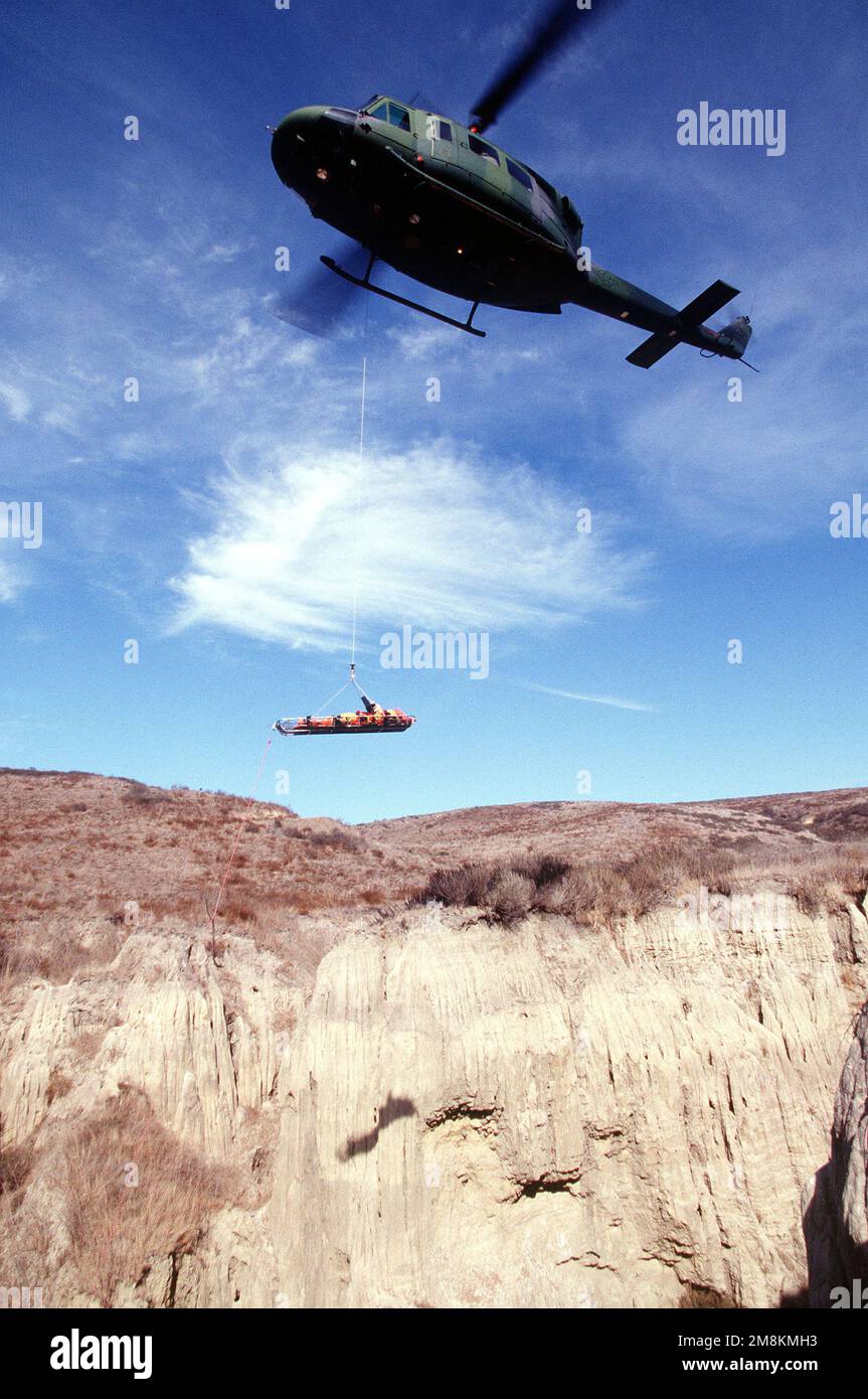 A UH-1H Iroquois helicopter from the 76th Rescue Squadron lifts an ...