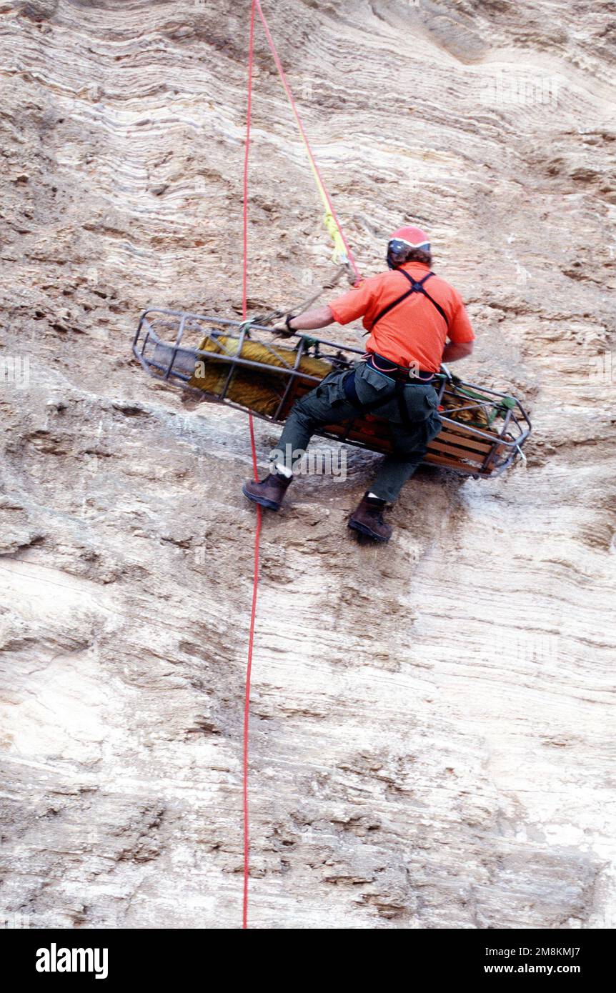 Alan Thompson of the Southern Kern County search and rescue team lowers ...