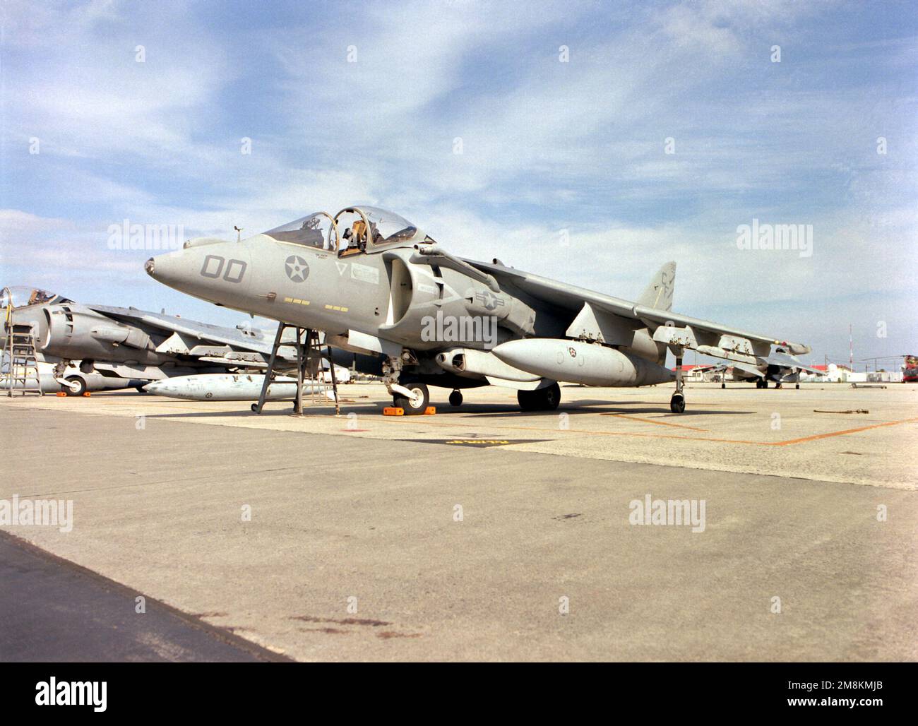 A left side view of an AV-8B Harrier on the flightline. Base: Marine ...
