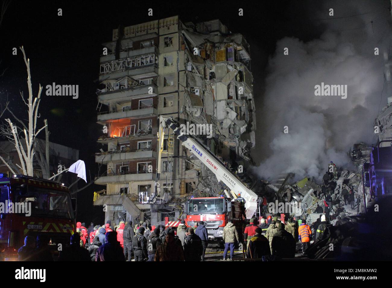 DNIPRO, UKRAINE - JANUARY 14, 2023 - Rescuers inspect the standing ...