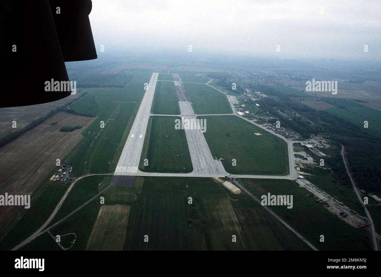 An aerial view of an unidentified airfield. The surrounding areas are ...