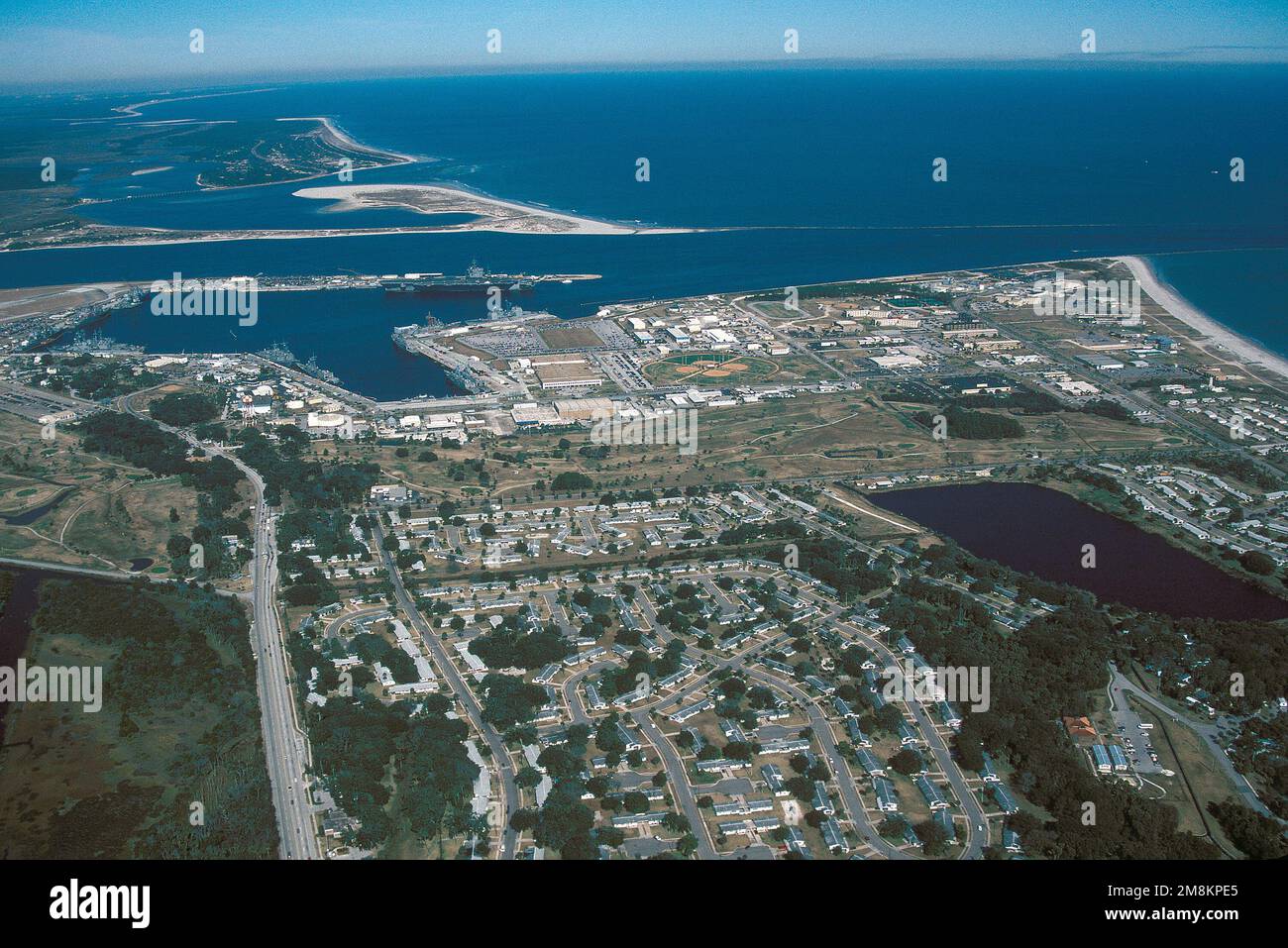A view looking north along the coastline showing the ship basin. The ...