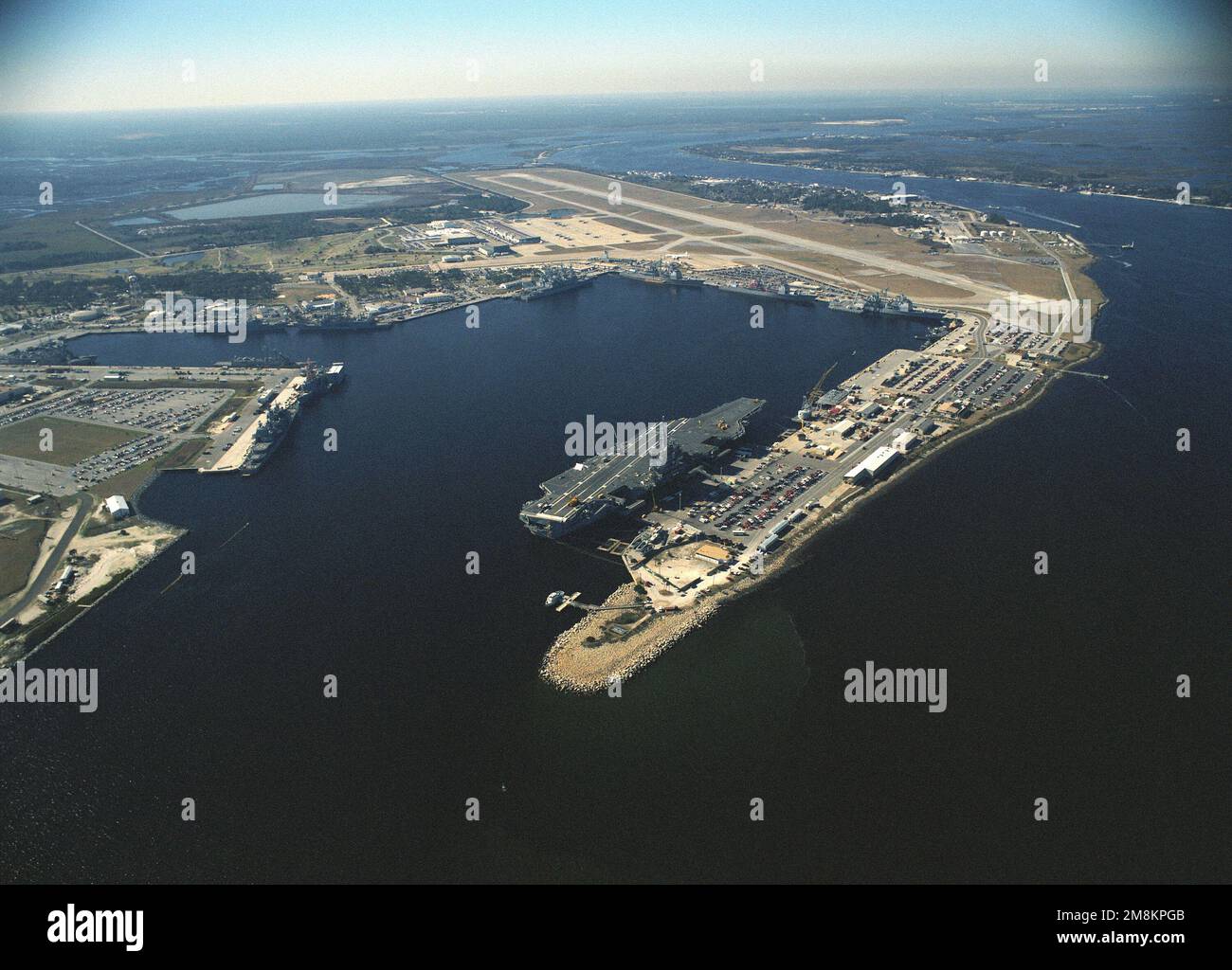 A view looking southwest at the ship basin with the air station beyond ...