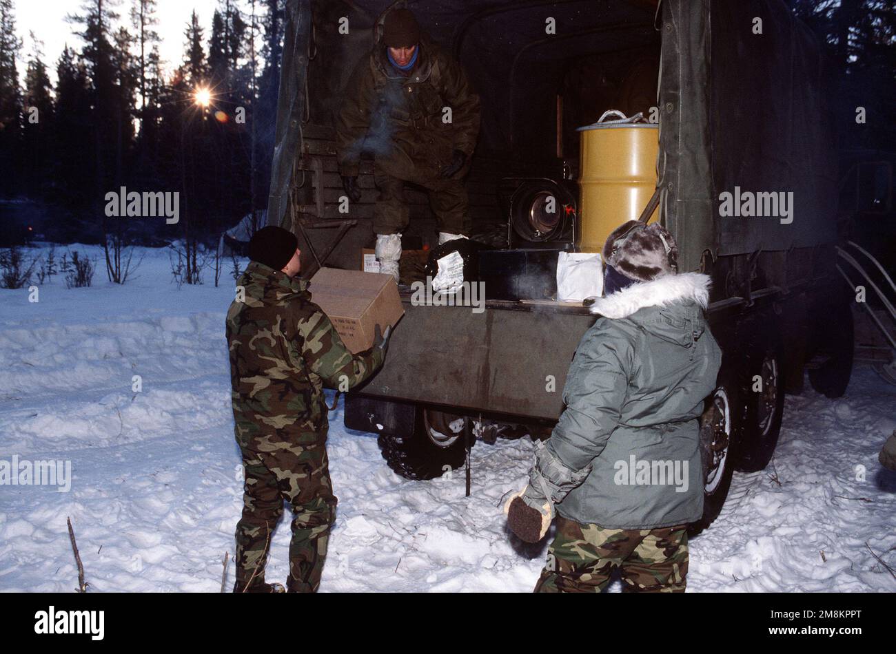 In the early morning sun and with snow-covered ground, AIRMAN 1ST Class ...
