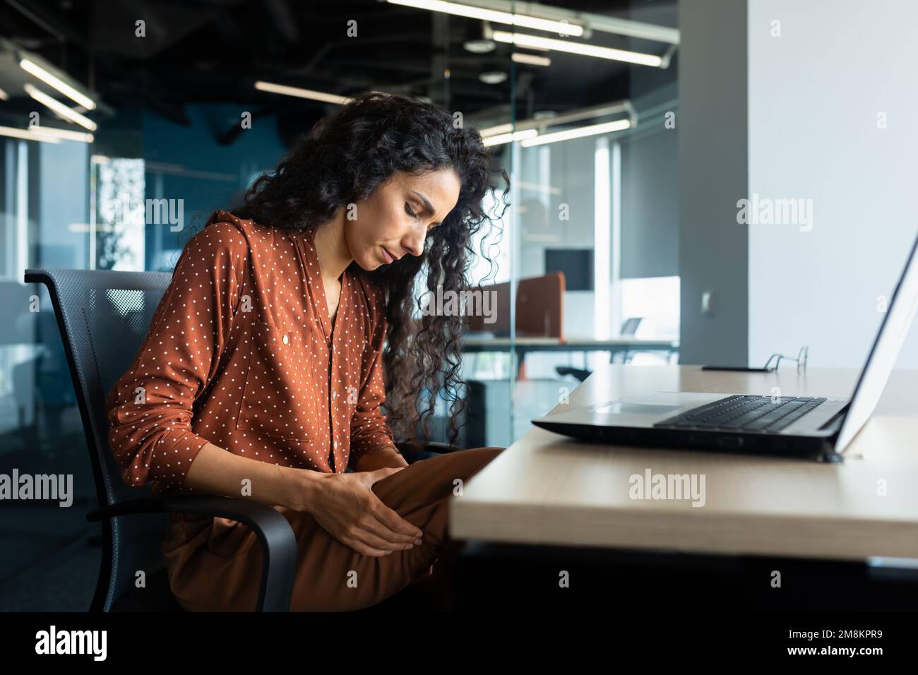 Latin American woman working inside office, business woman has severe ...