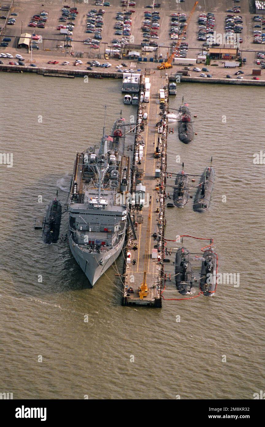 A bow-on view of the submarine tender USS L.Y. Spear (AS-36) tied up at ...