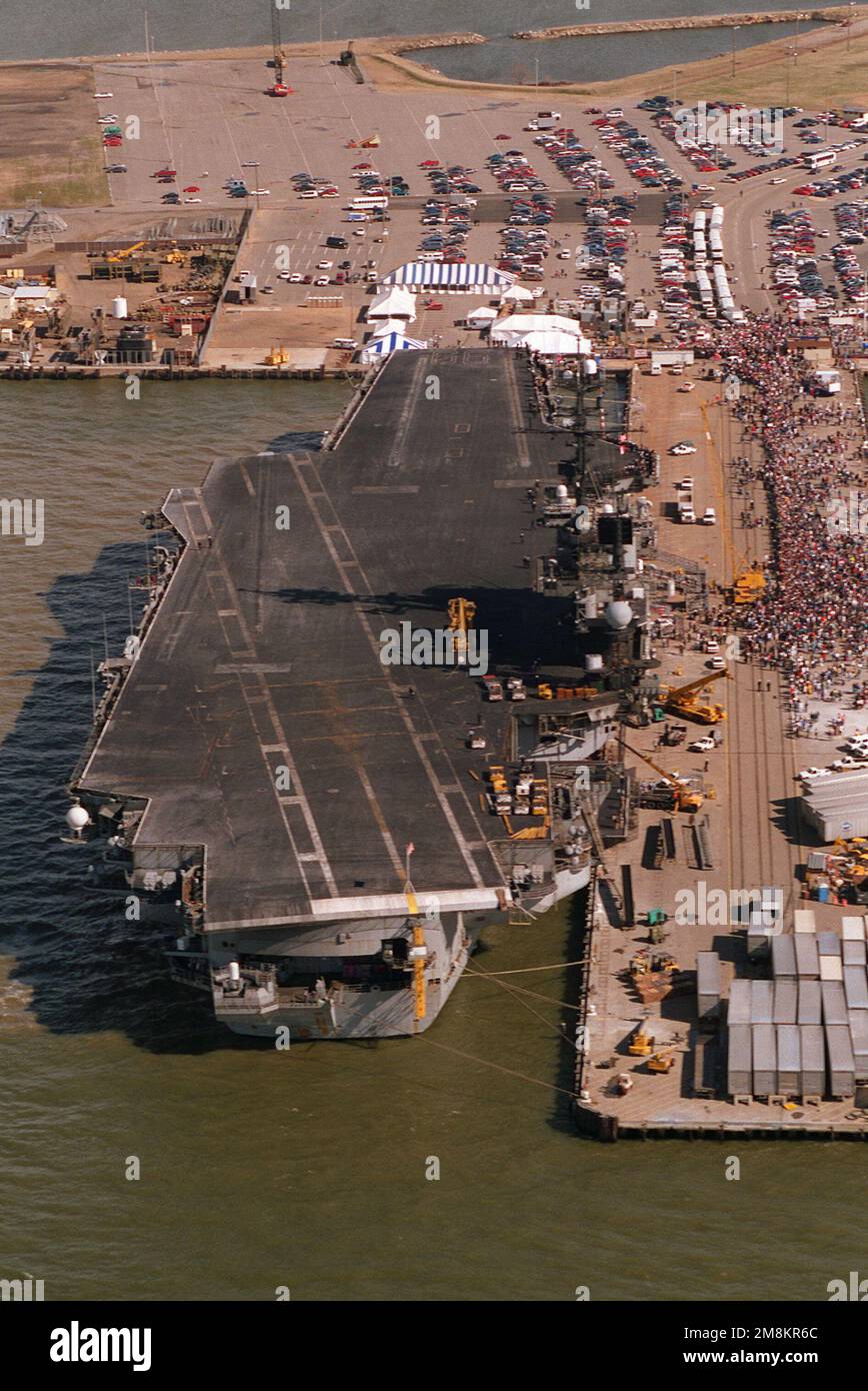 Aerial stern view of the aircraft carrier USS America (CVN-66) as the ...