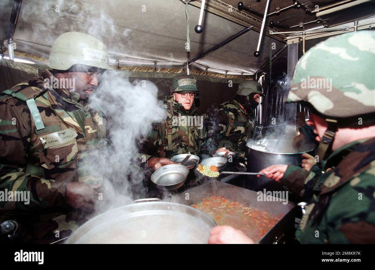 In the Mobile Kitchen Trailer (MKT), members of the 21st Services ...