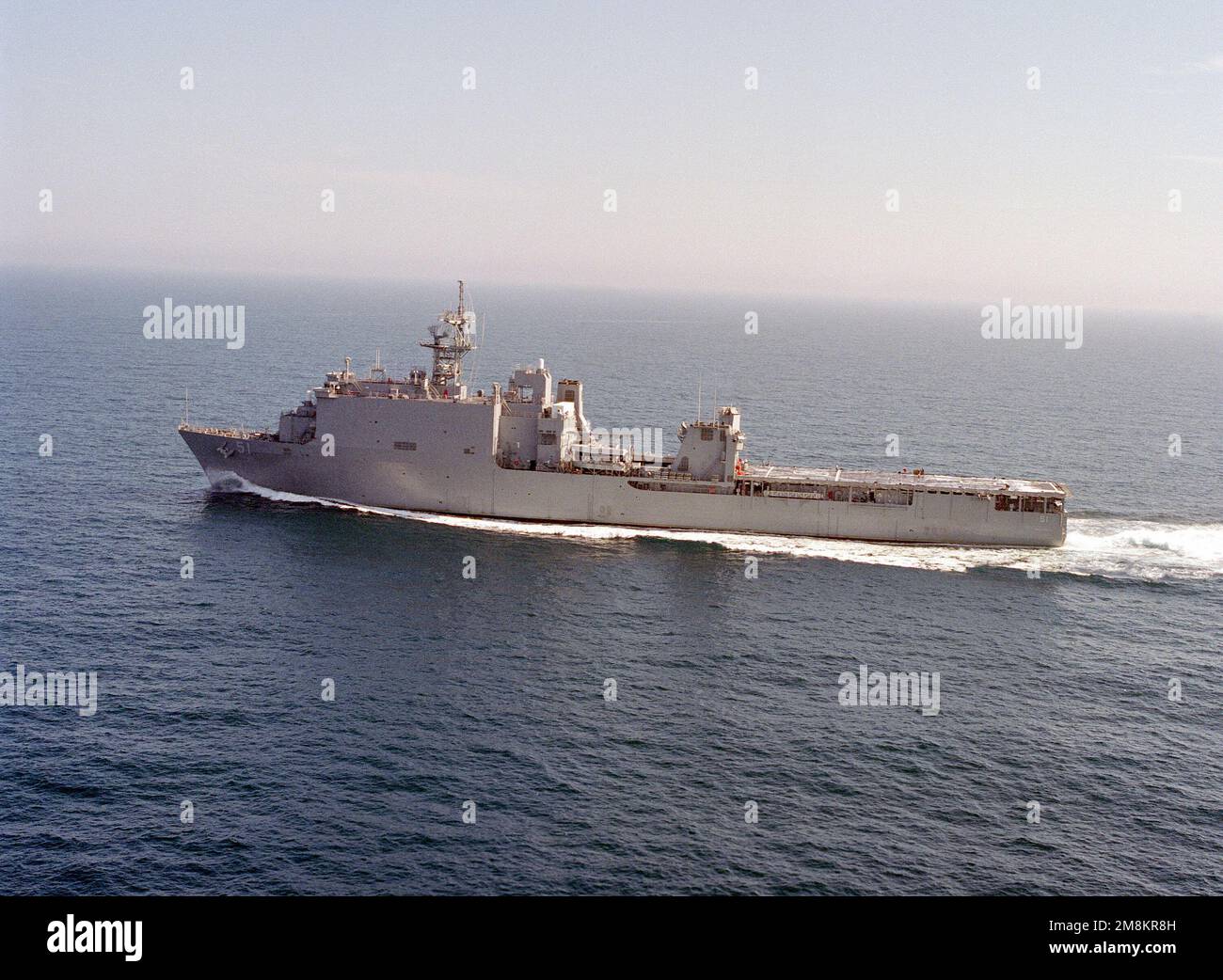 An aerial port beam view of the amphibious dock landing ship USS OAK ...