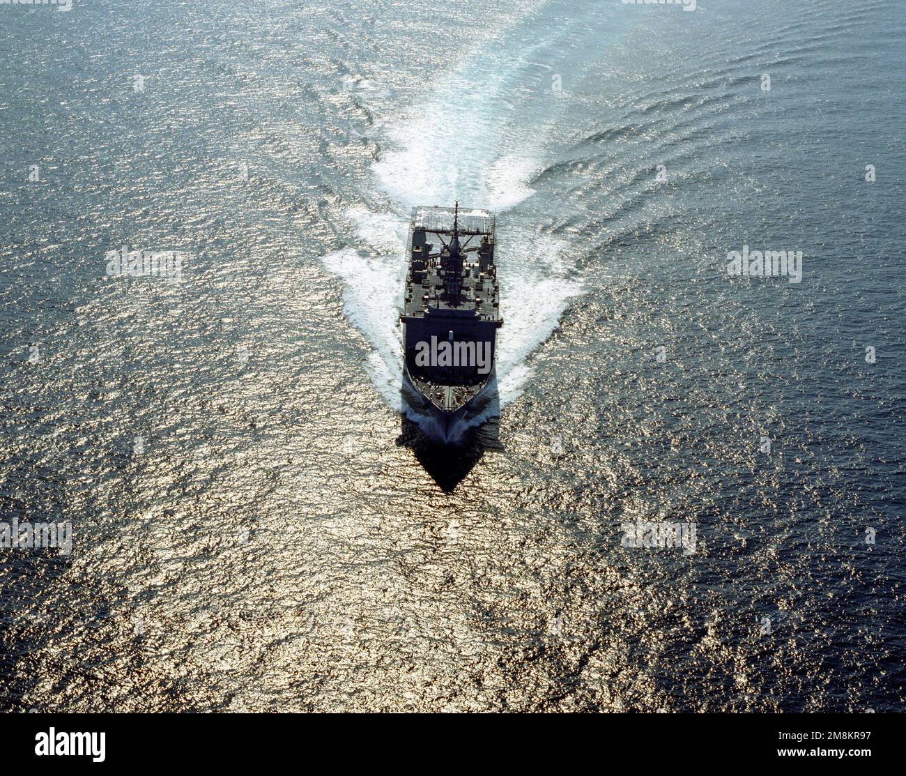 An aerial high oblique bow-on view of the amphibious dock landing ship ...