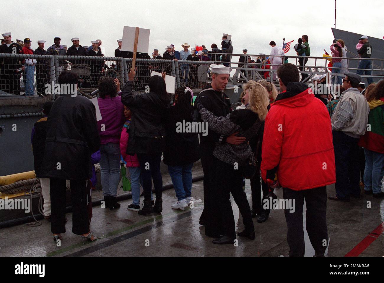 Family and friends greet the sailors of the guided missile frigate USS ...