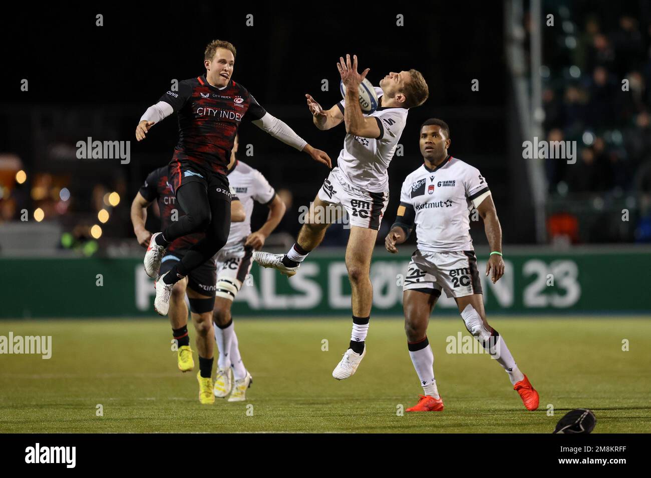 Kyle Godwin of Lyon Rugby catches an aerial ball, under pressure from ...