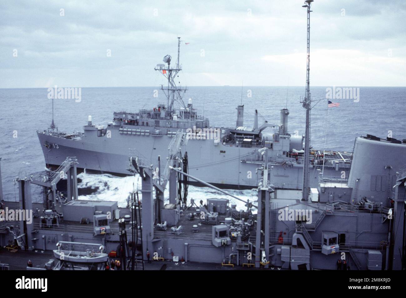 The fast combat support ship USS SEATTLE (AOE-3), foreground, and the ...