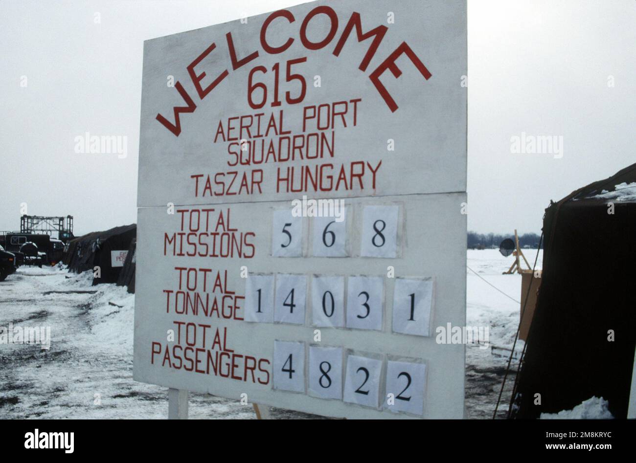 A welcome sign at the base shows total number of missions, tonnage, and ...