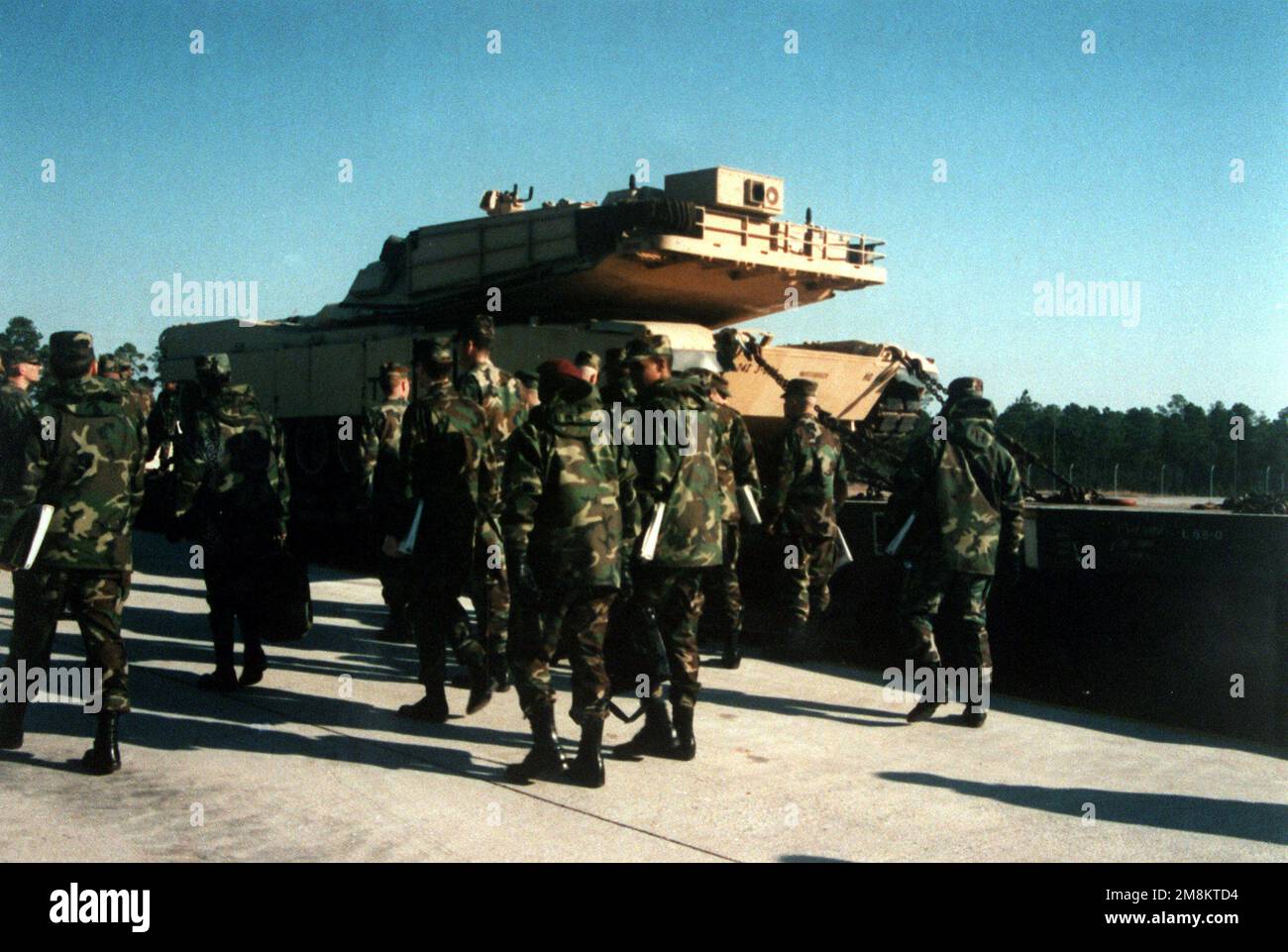 Members of the 24th Infantry Division pass by an M-1 Abrams Tank that ...