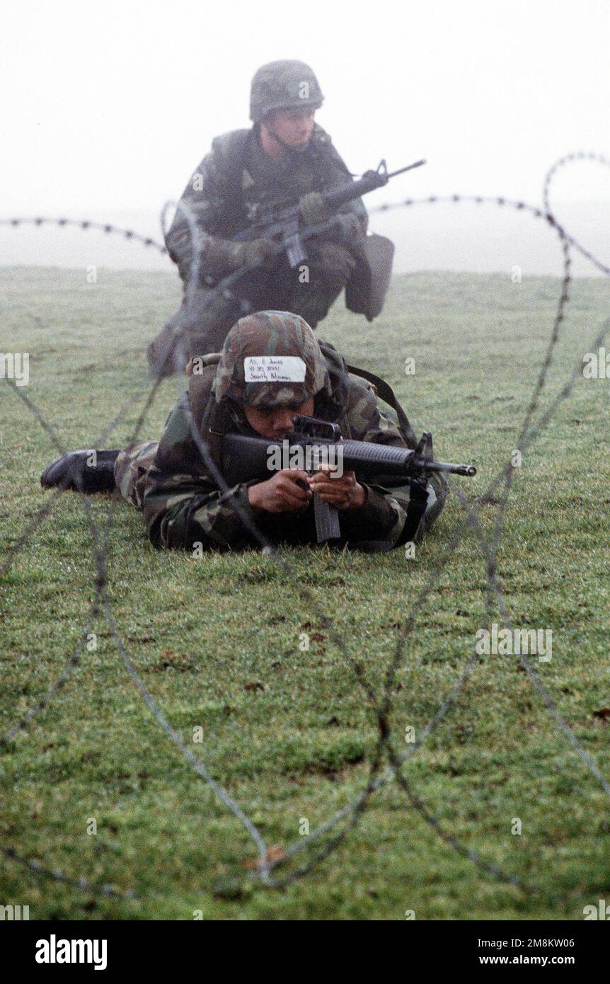 AIRMAN 1ST Class Edward Jones of the 48th Security Police Squadron lays ...