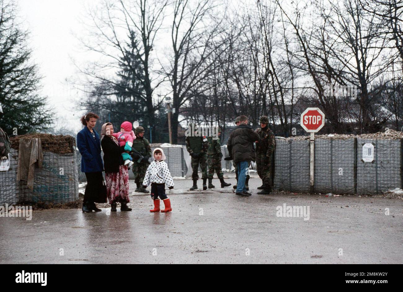 Bosnian villagers wait for transportation in front of the Tuzla Air ...