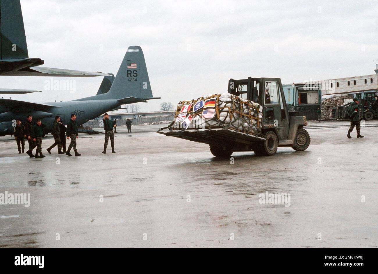 United Nations forces unload the last pallet of relief supplies from a ...