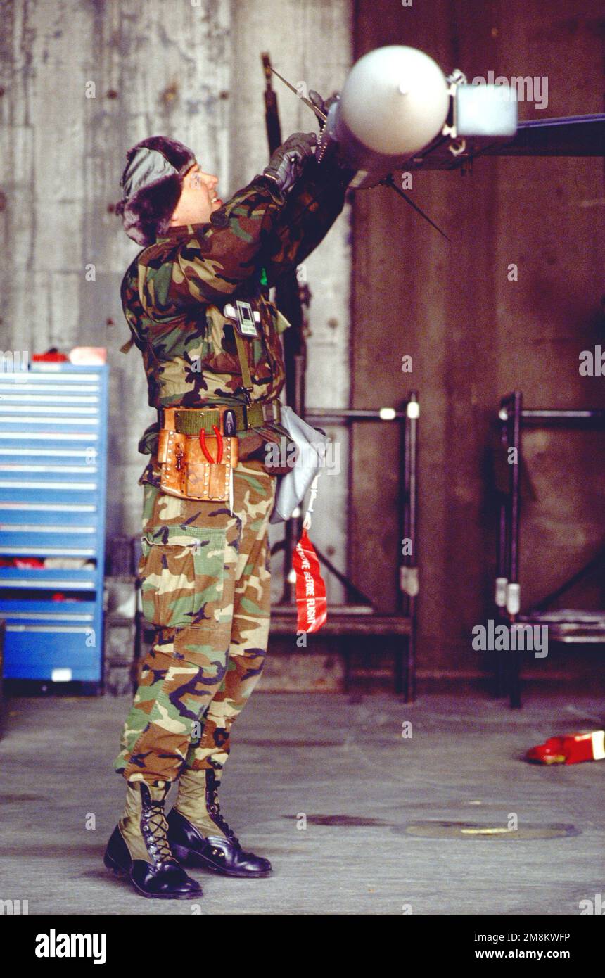 STAFF Sergeant Rick Teshendurf prepares to download weapons from an F ...