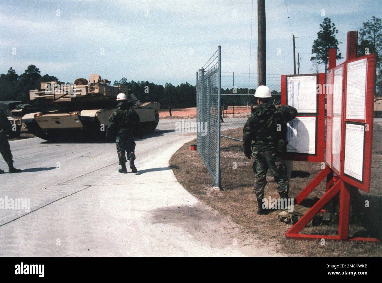An M-1 Abrams Tank moves through the gate at the rail marshaling area ...
