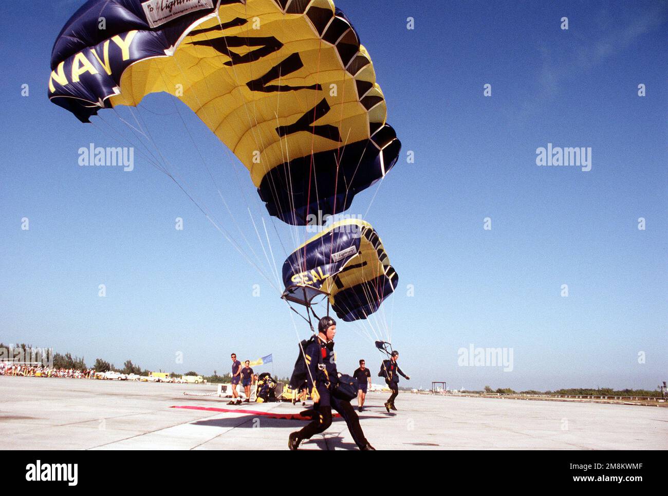 Members of the U.S. Navy's parachute team, the Leap Frogs, perform ...