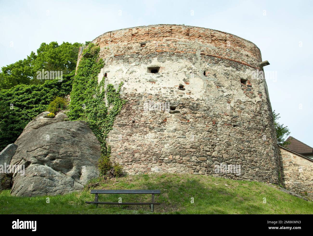 The view of a park bench near historic round fortress in Durnstein ...