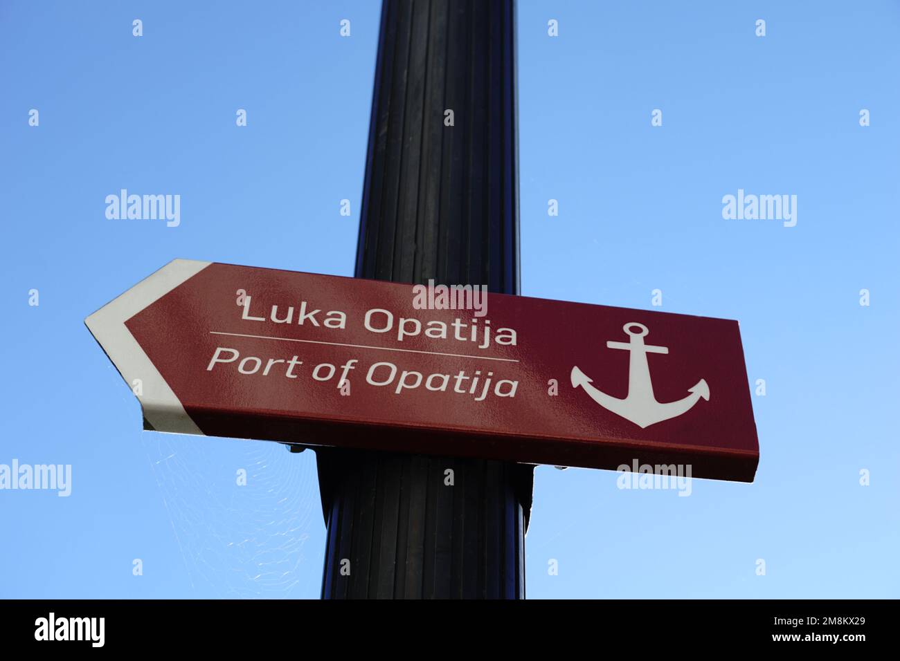 Opatija, Croatia, 14th January 2023. Red road sign showing the way to ...