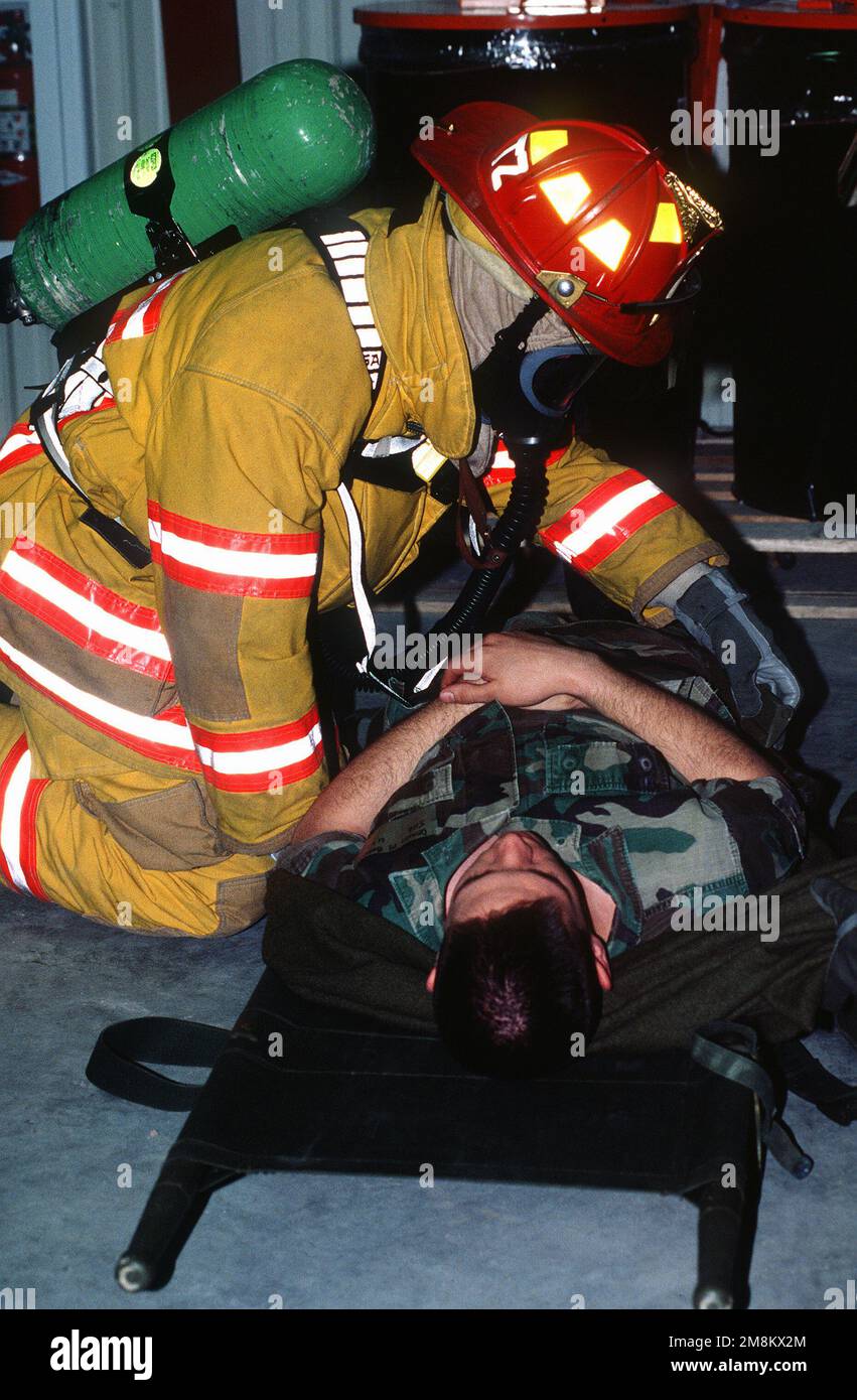 STAFF SGT. Randy Fitzpatrick of the 90th CES/CEF places AIRMAN Sean ...