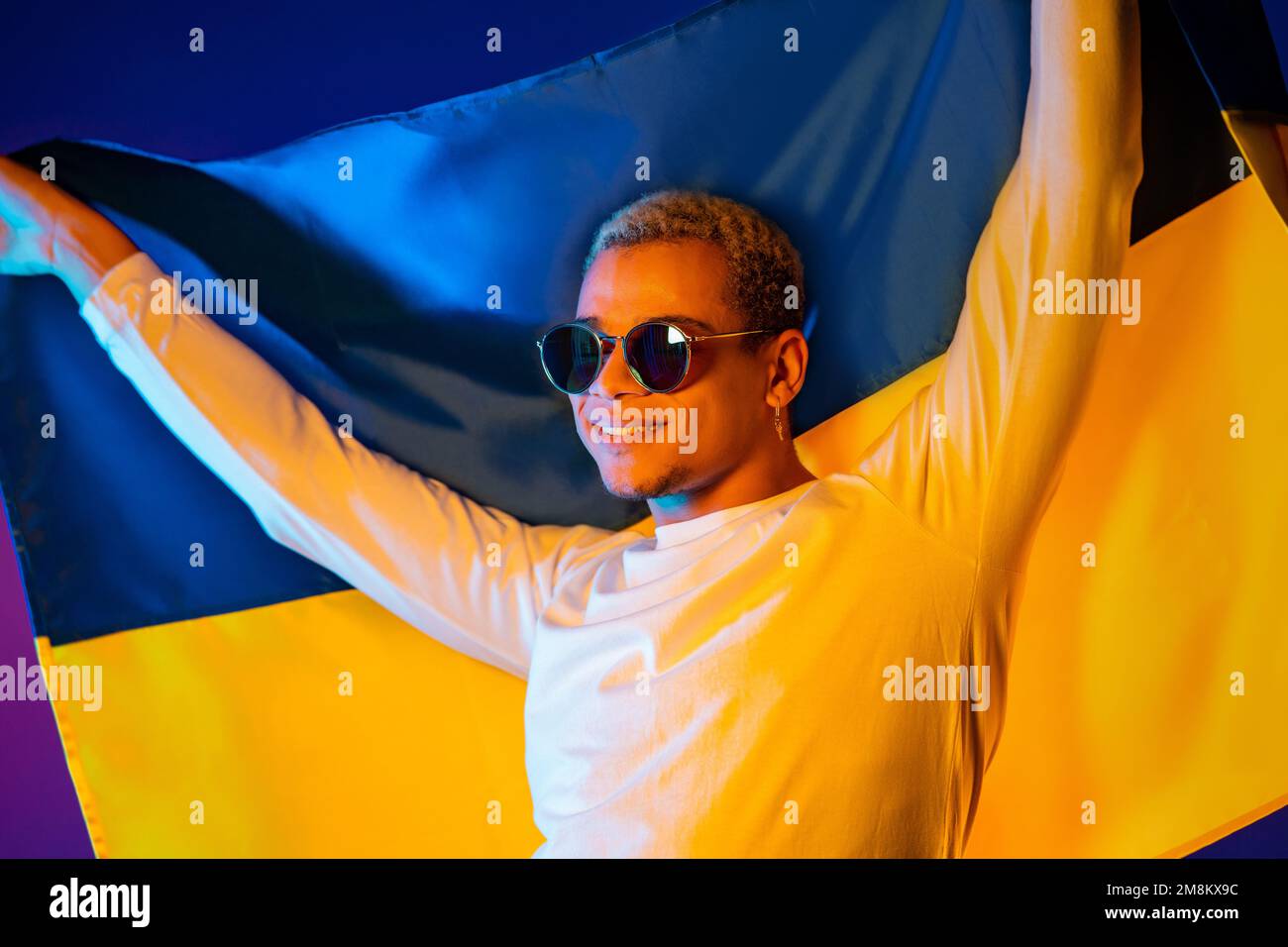 Smiling man with national Ukrainian flag. Ukraine, patriot, victory in ...