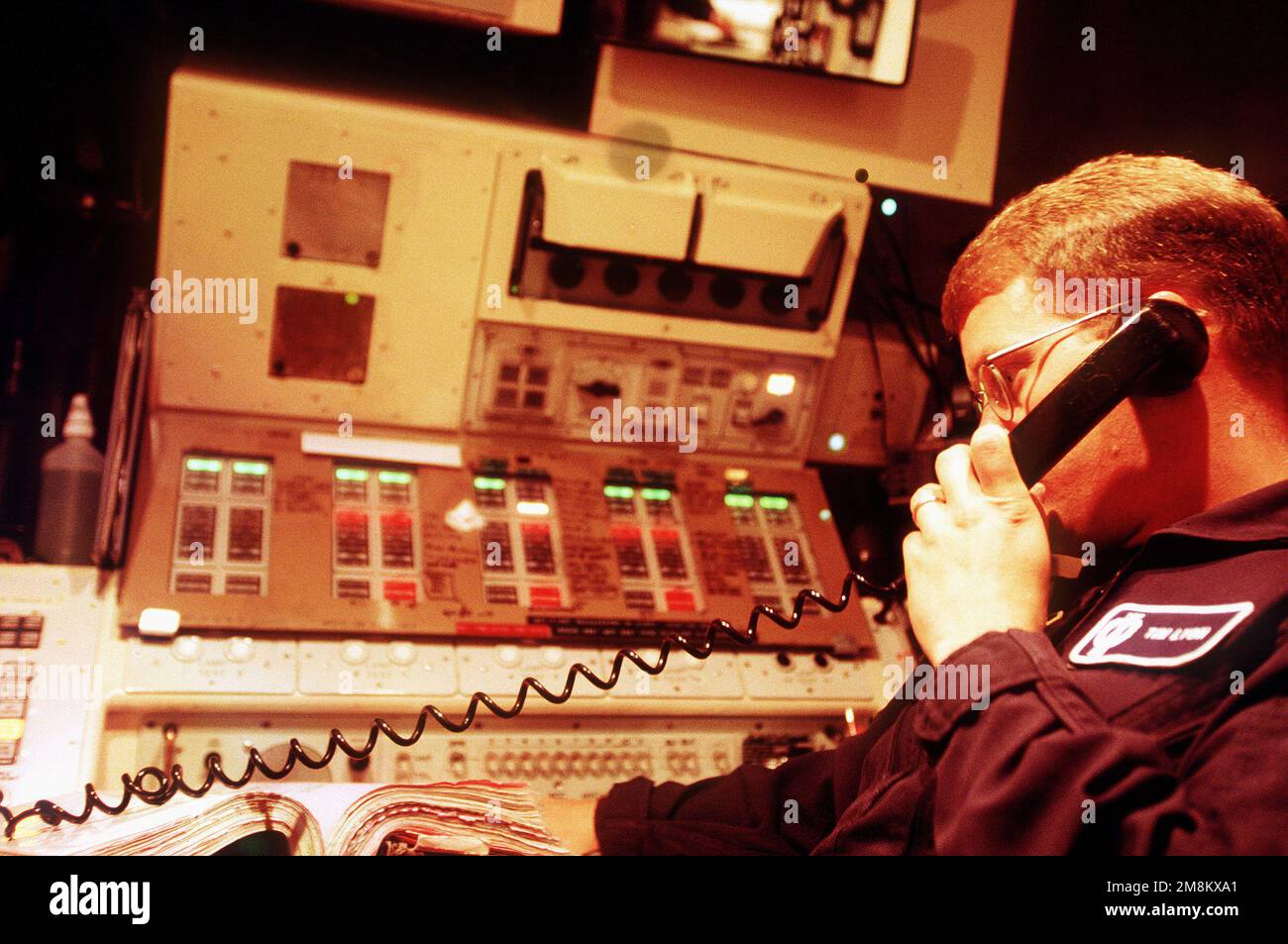 CAPT. Tim Lyon from the 400th Missile Squadron talks on the phone with ...