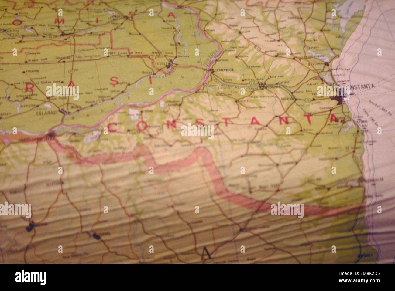 A map showing the location of Constanta, Romania on the wall at ...