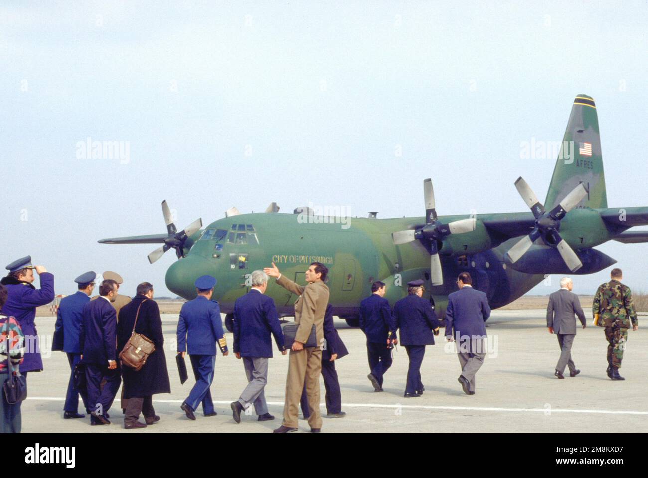 An Air Force survey team walks across the tarmac at Timisoara Air Base ...