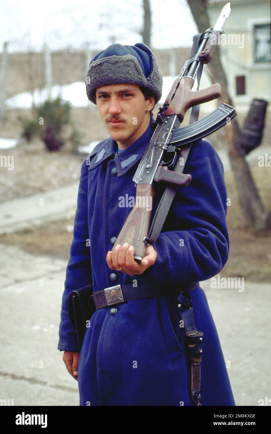 Romanian soldier, Nenciu Marian, stands guard duty near the railroad at ...