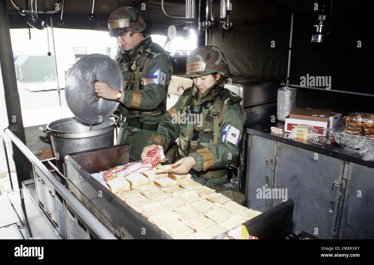 Under the canopy of the 341st Services Squadron's mobile field kitchen ...