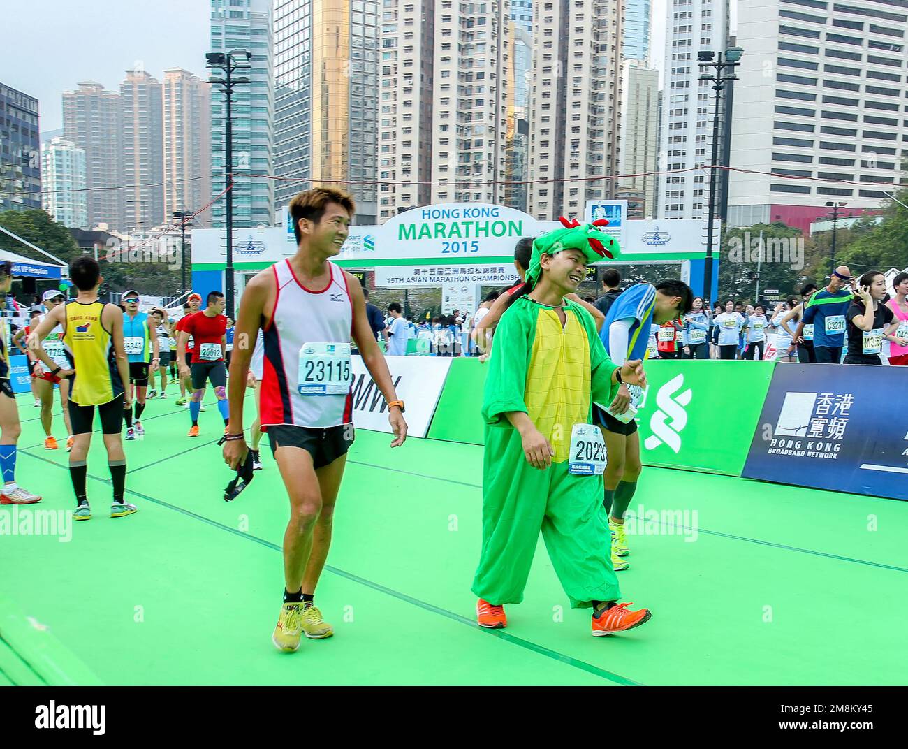 25-01-2015 Hong Kong Hong Kong Marathon runners dressed as a Dragon and smilng with another ...