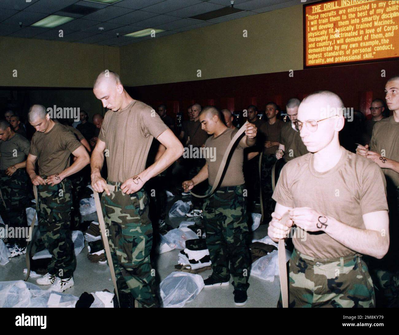 New recruits to the Marine Corps Recruit Depot are issued uniforms and ...