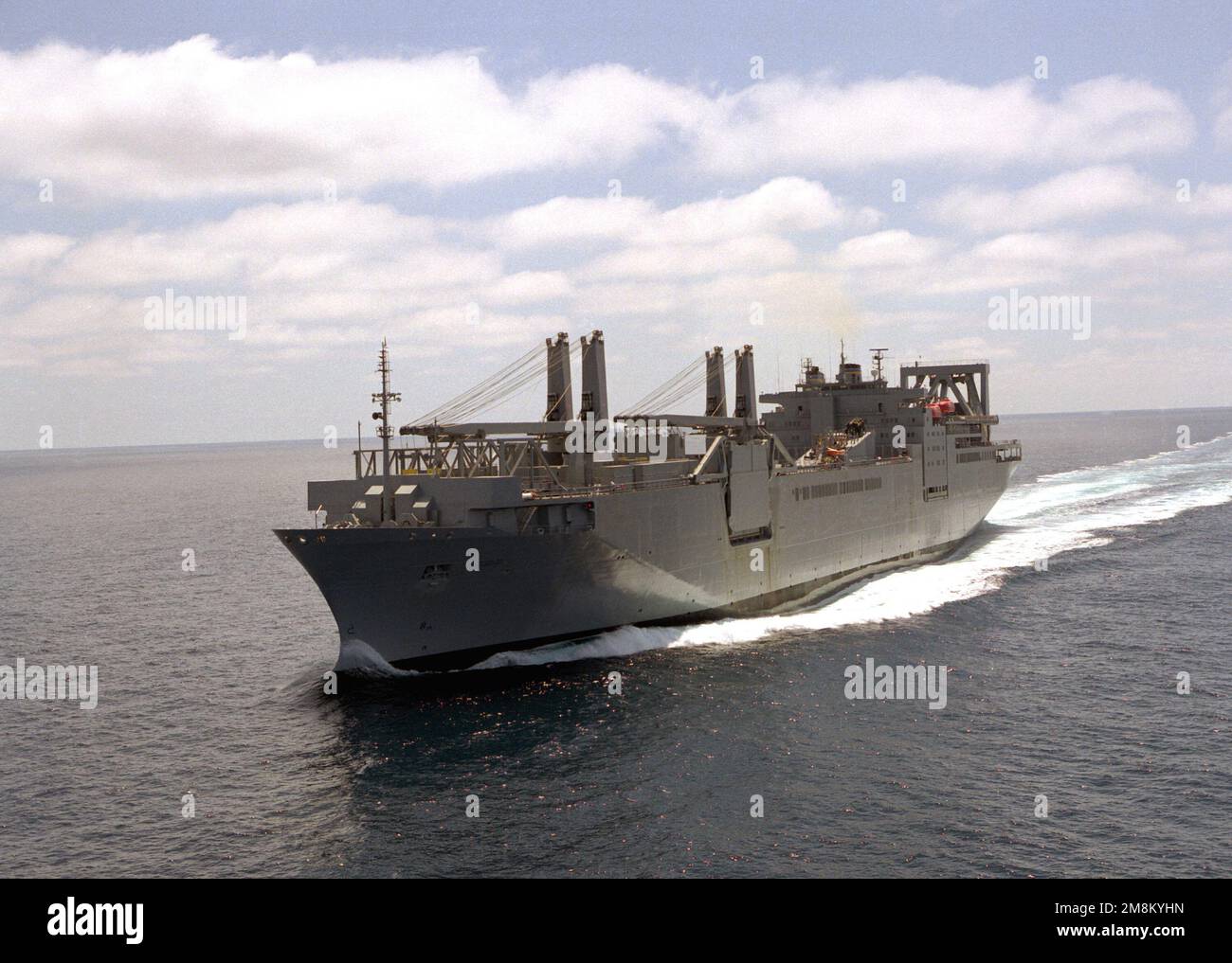 Low oblique aerial port side view of the Military Sealift Command (MSC) vehicle transport ship ...
