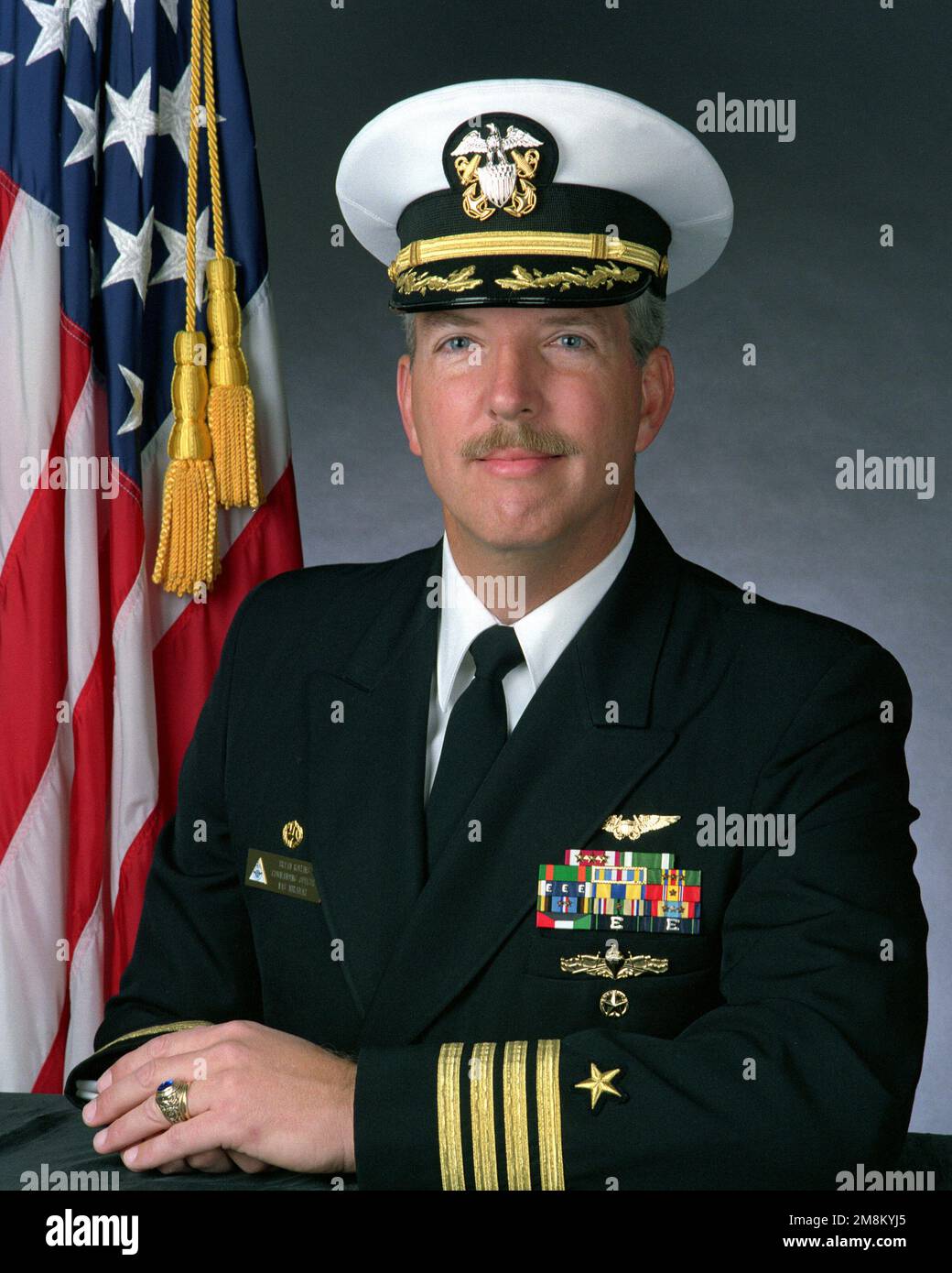 Naval officer portrait of CAPT Bryan L. Rollins, USN (covered). Base ...