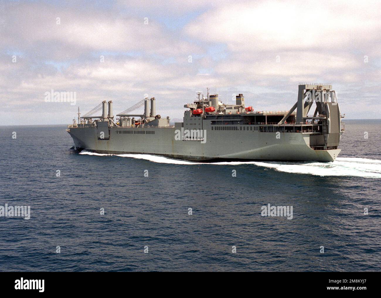 Low oblique aerial port side view of the Military Sealift Command (MSC) vehicle transport ship ...