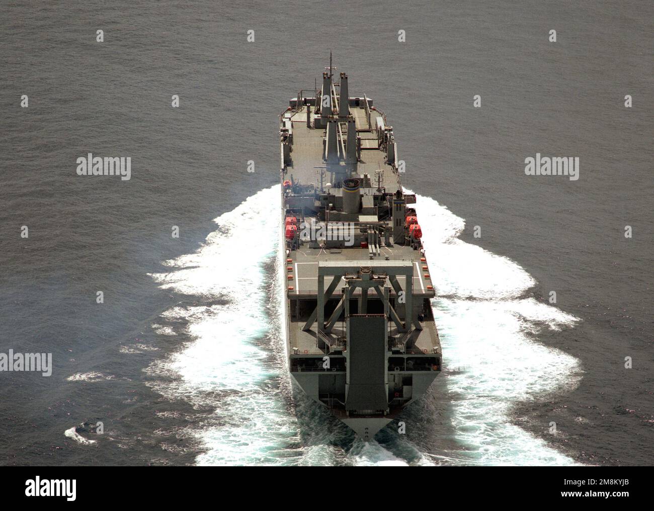 High oblique aerial stern-on view of the Military Sealift Command (MSC) vehicle transport ship ...