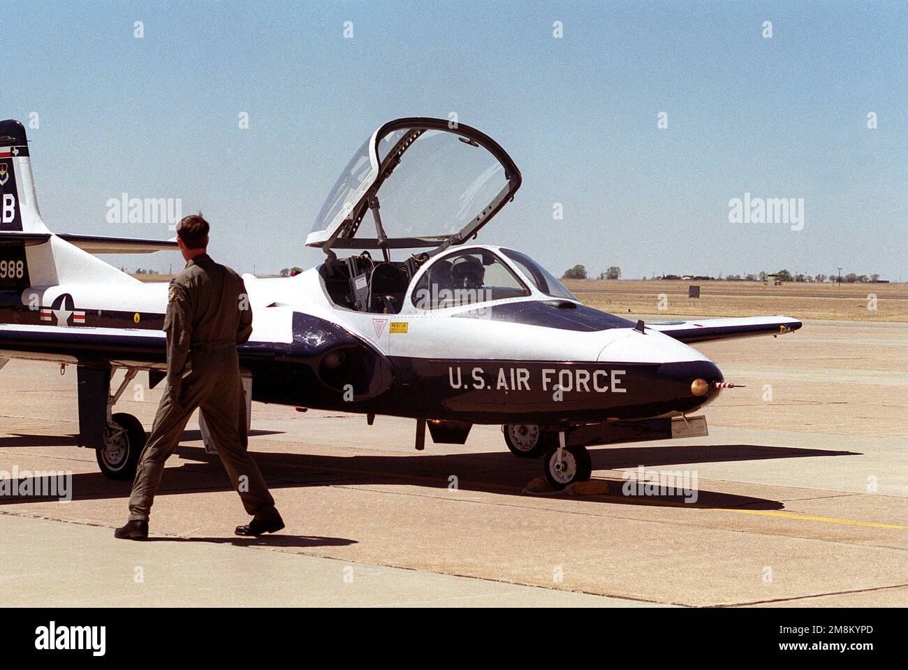 CAPT. Brian Henderson does a preflight inspection of his T-37 aircraft ...